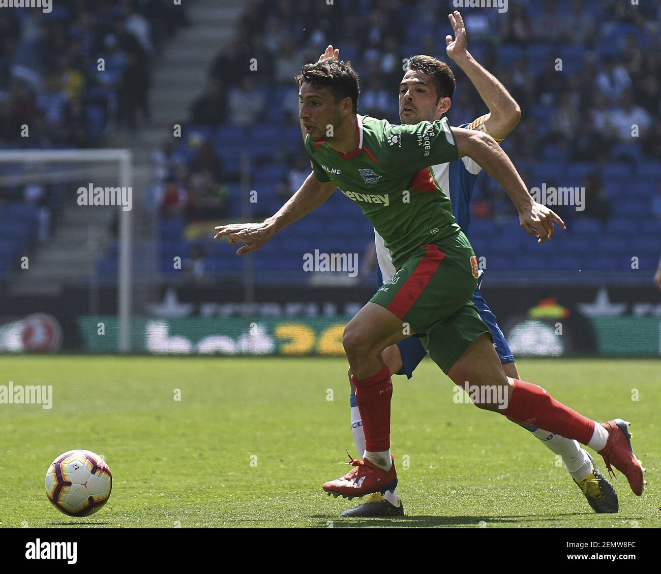 Victor Sanchez of RCD Espanyol and Jonathan Calleri of Deportivo Alaves ...