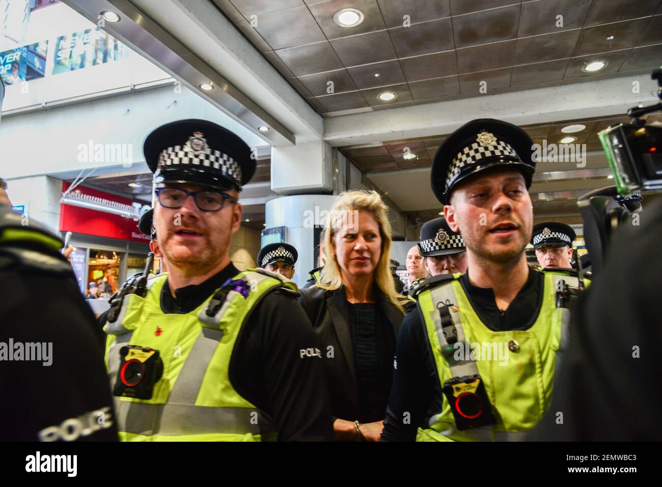 A climate change protester who glued herself to the roof of a DLR train ...