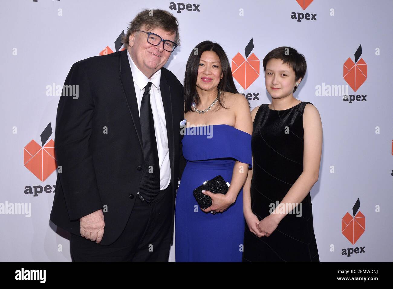 (L-R) Filmmaker Michael Moore, Sonia Low and daughter Juliette attend ...