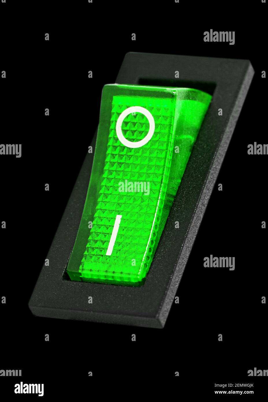 Green power switch at ON position, isolated on black background Stock ...