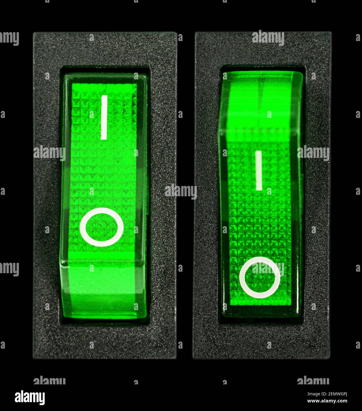 Green power switches at ON and OF position, isolated on black ...