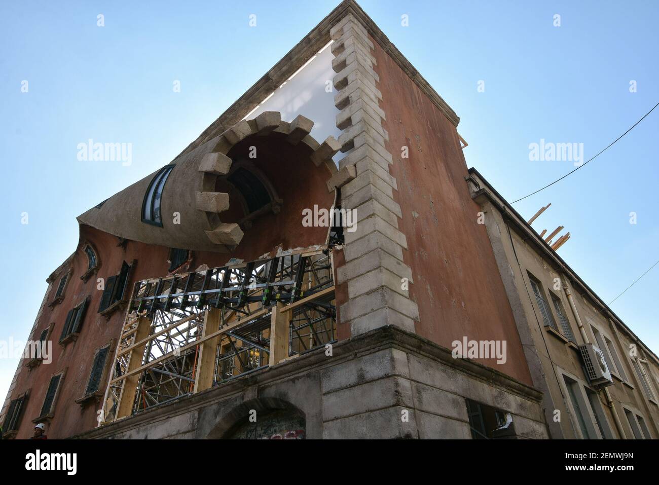 Workers dismantling Alex Chinneck work. "Revealed", which was installed ...
