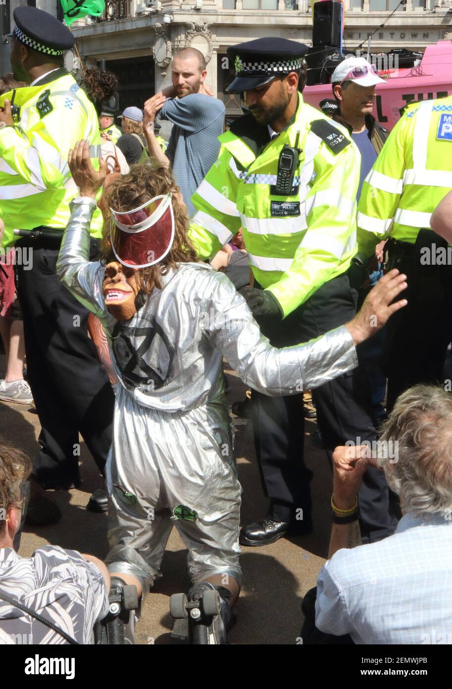 An activist seen on his knees pleading with police to let him through ...