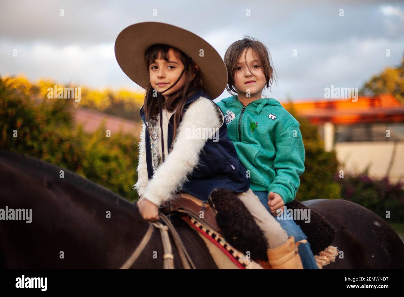 Two young children seen riding a horse during the "Ciolla Week" rodeo ...