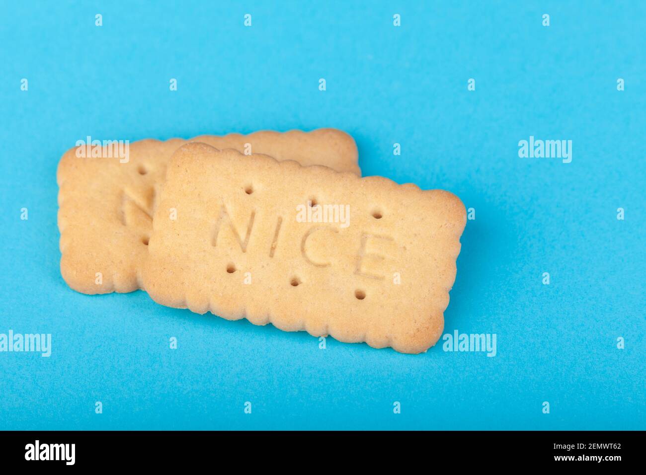 Two nice biscuits on a plain background Stock Photo - Alamy