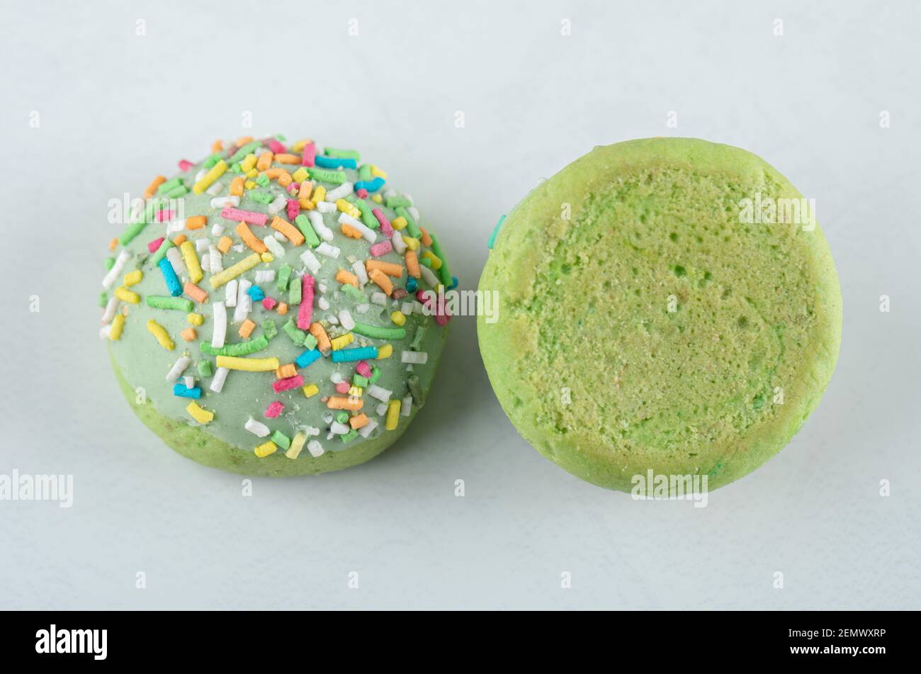 Green cookies with sprinkles on white background Stock Photo - Alamy