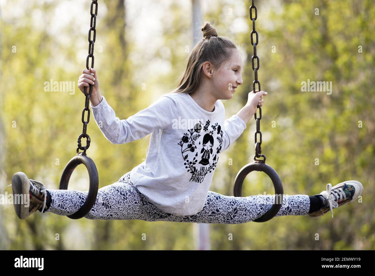 A girl is seen exercising at the Kachalka outdoor gym in Kyiv, Ukraine ...