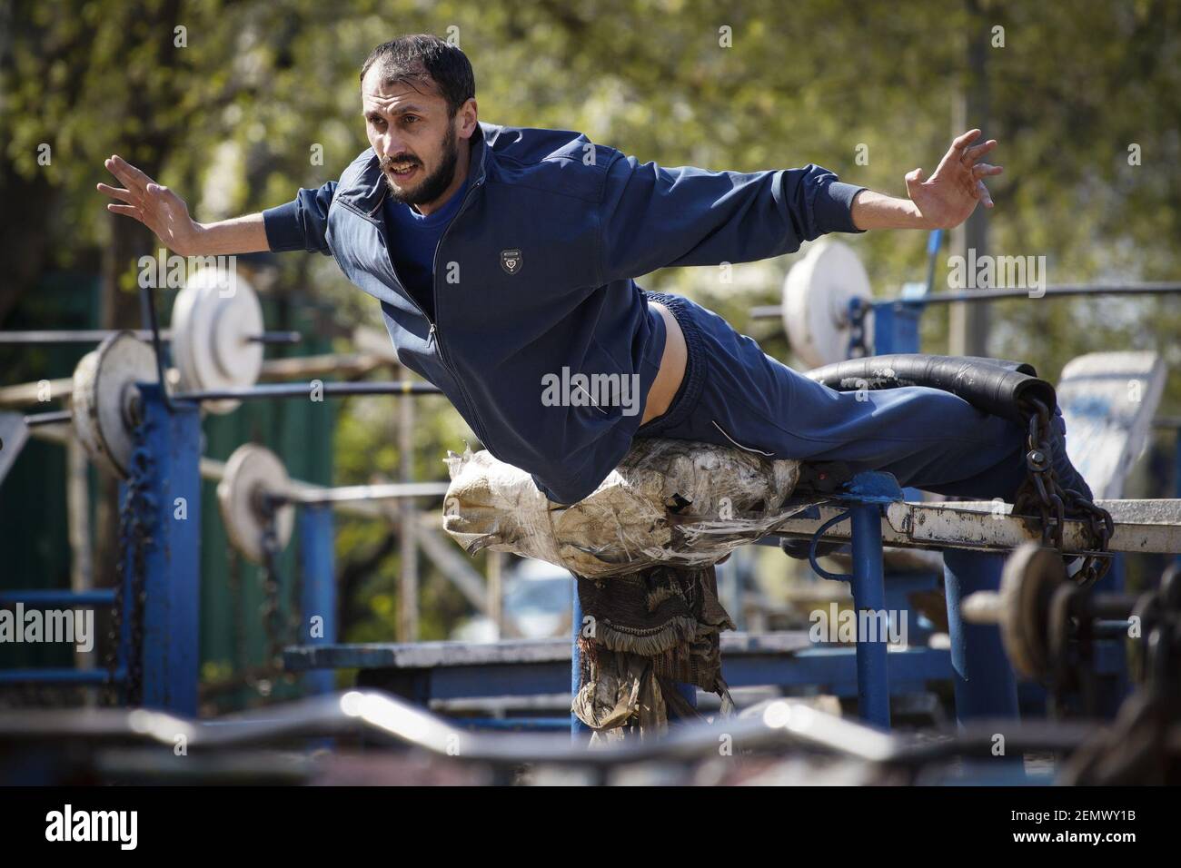 A man is seen exercising at the Kachalka outdoor scrapyard gym (Photo ...