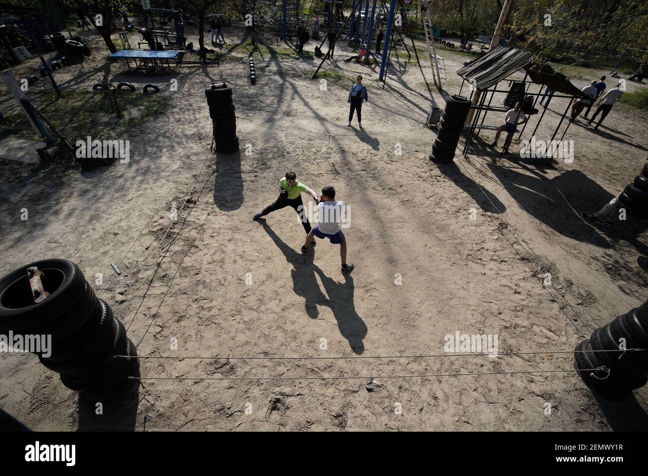 Young men are seen boxing at the Kachalka scrapyard gym in Kyiv ...