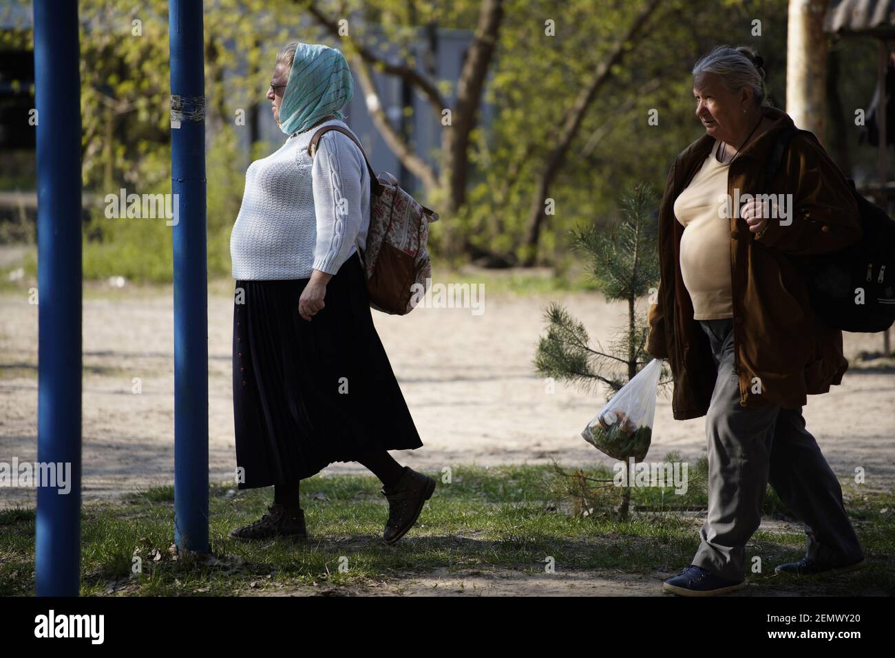 Elderly women are seen strolling through the Kachalka scrapyard gym in ...