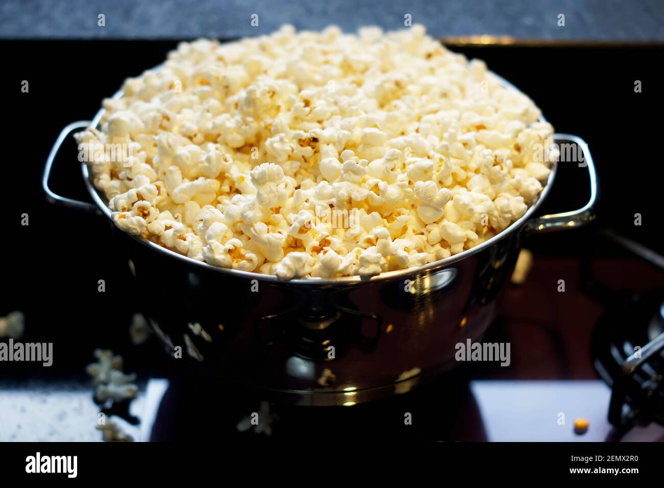 A stainless pan full of popcorn. Photo focus in the middle of the ...