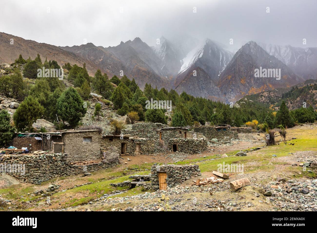 Stone buildings in Karakorum mountains cloudy weather Stock Photo - Alamy