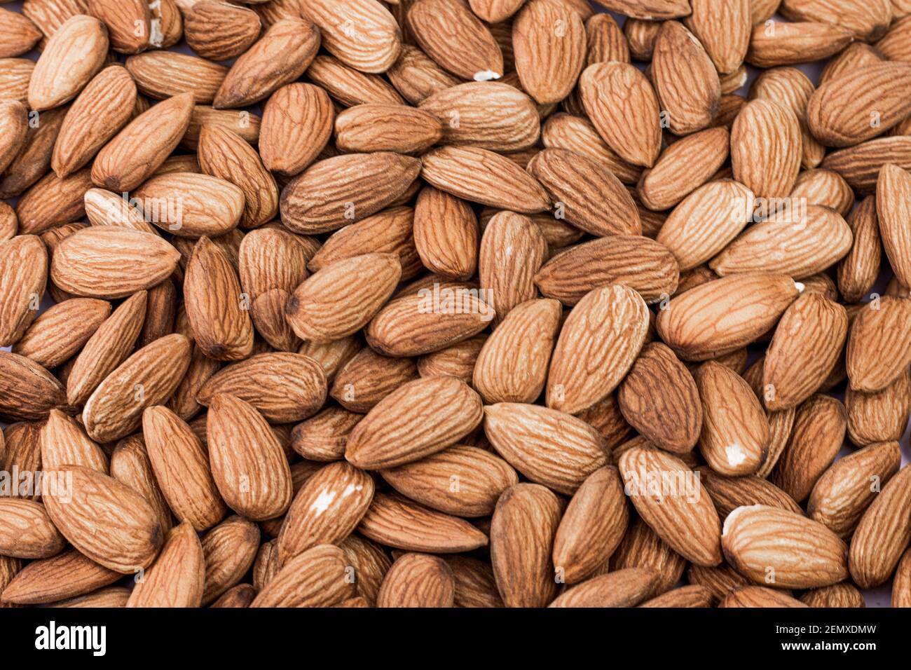 Almonds background flat lay, top wave image Stock Photo - Alamy