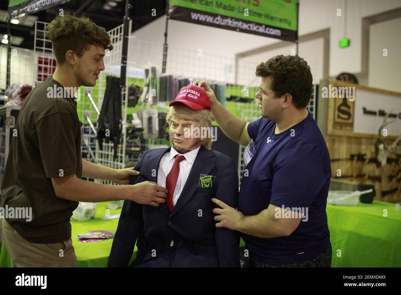 Workers adjust a Papier-Mâché replica of United States President Donald ...