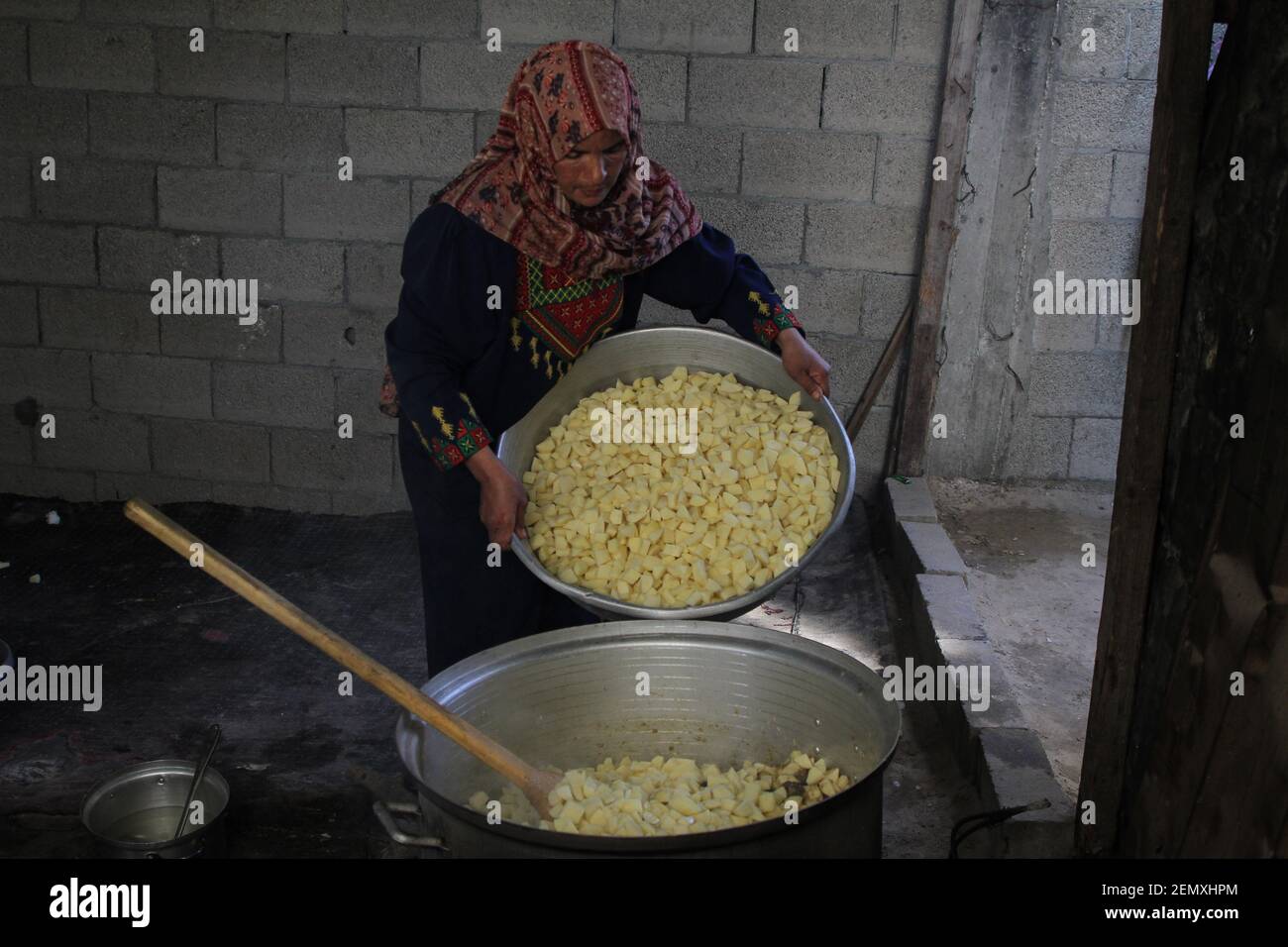 Gaza. 8th Feb, 2021. Palestinian woman Samira Abu Amra cooks food for ...