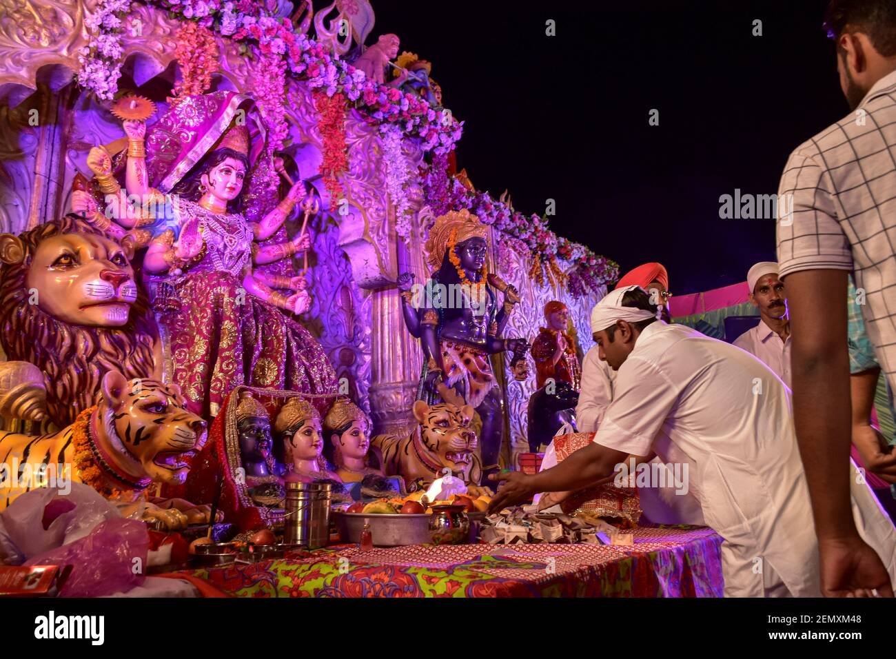 A devotee seen performing rituals. Jagran is a Hindu ritual, consisting ...