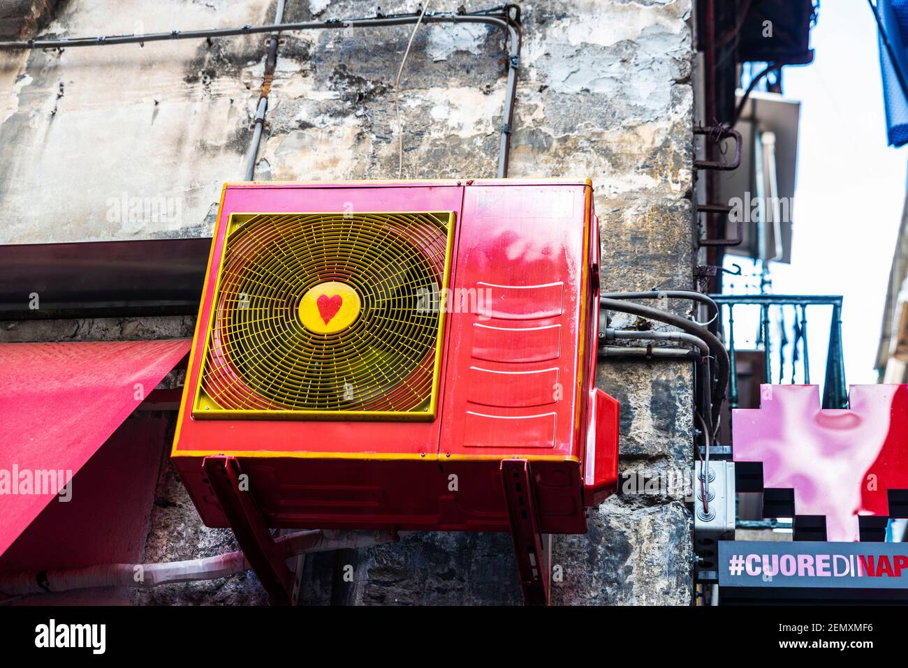 Naples, Italy - September 9, 2019: Red air conditioner with a drawn ...