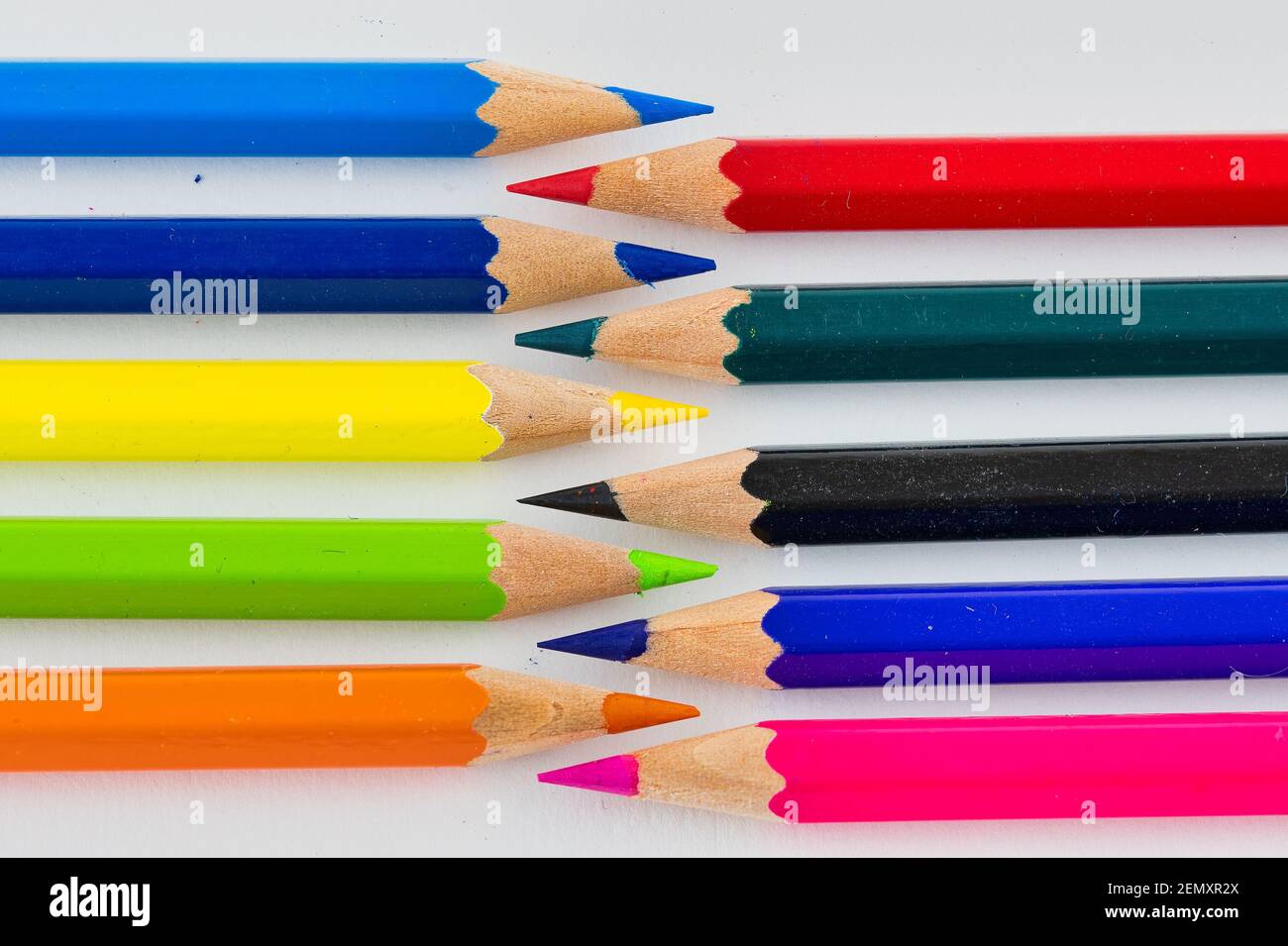 Different coloured colouring pencils arranged in lines Stock Photo - Alamy