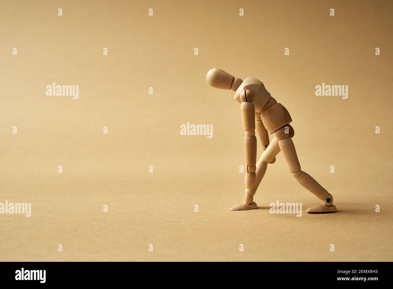 Wooden figure representing an exhausted person, with copy space Stock ...