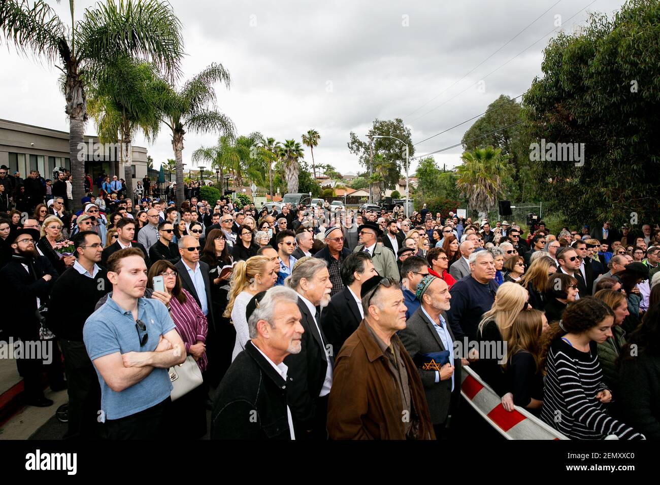Mourners gather outside of Chabad of Poway for a memorial service for ...