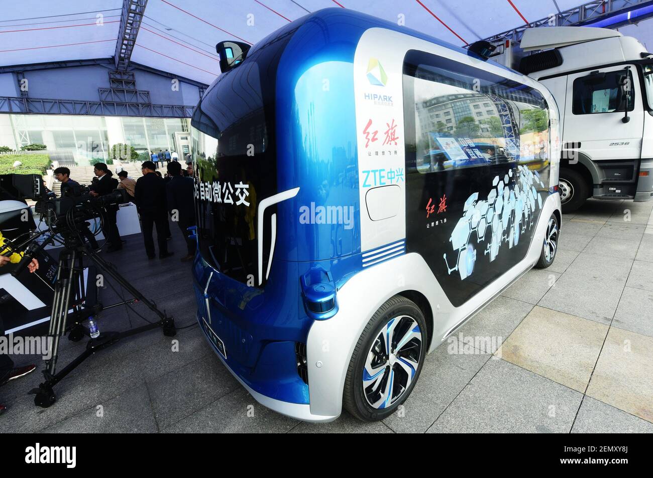A FAW Hongqi or Red Flag unmanned 5G minibus is parked during an expo ...
