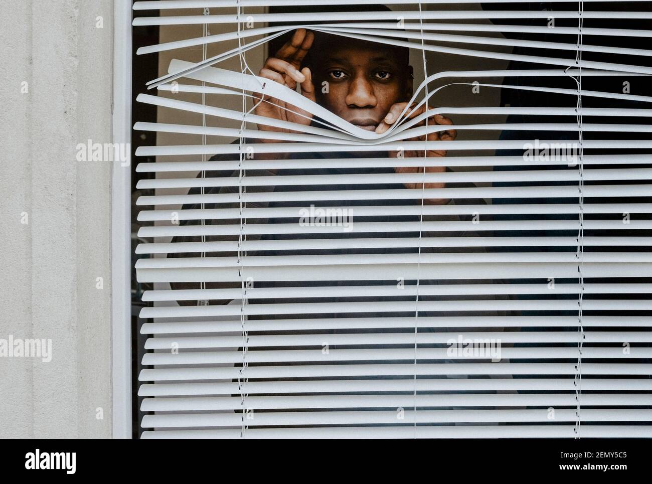Person looking out window berlin hi-res stock photography and images ...