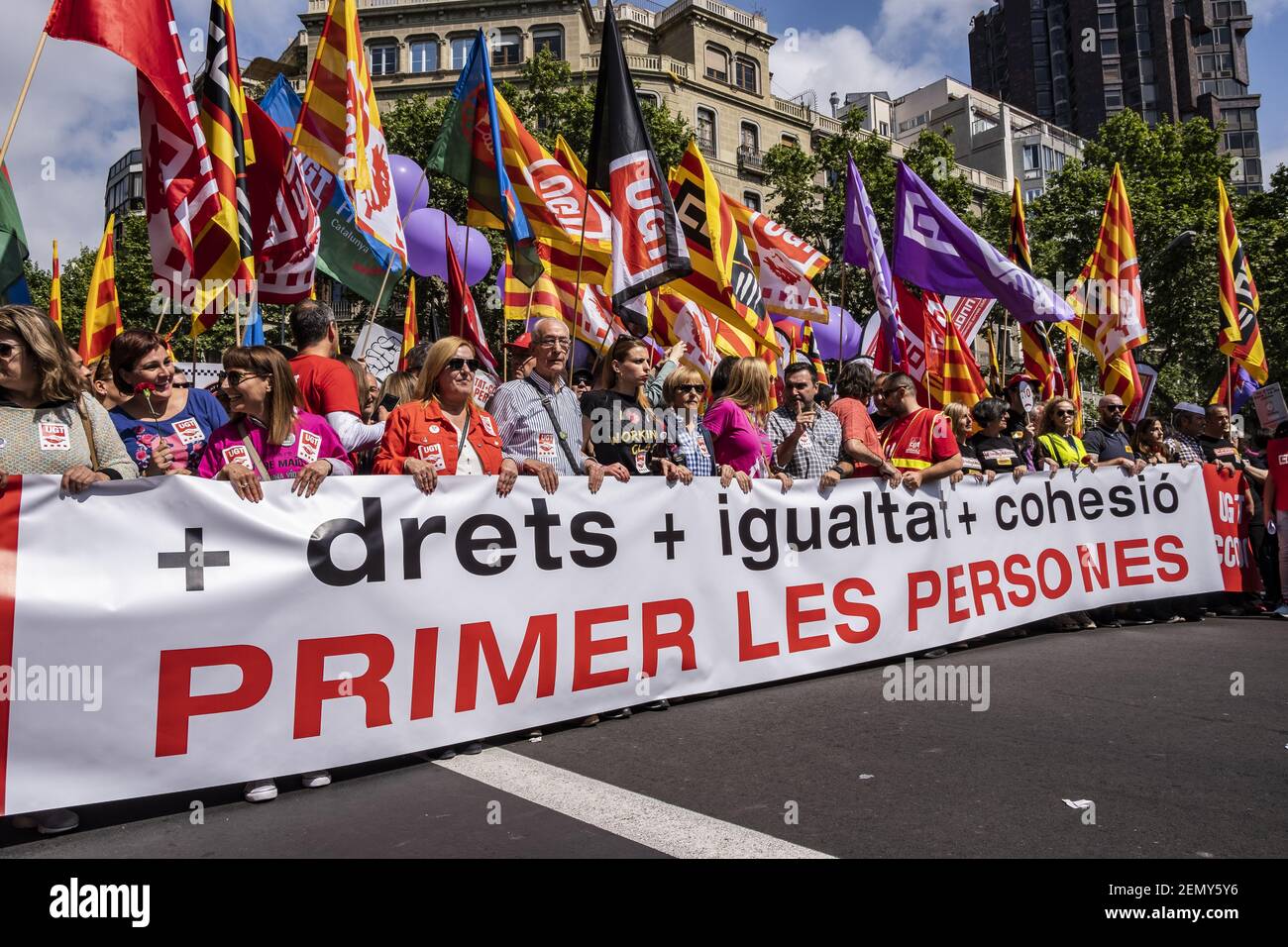 Protesters are seen holding a banner and flags during the International ...