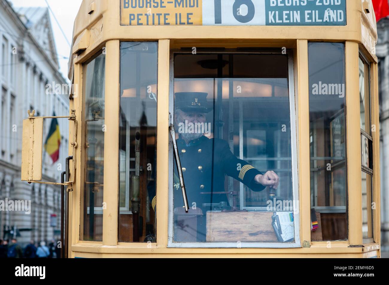 A tram driver is seen operating a historical tram during the ...
