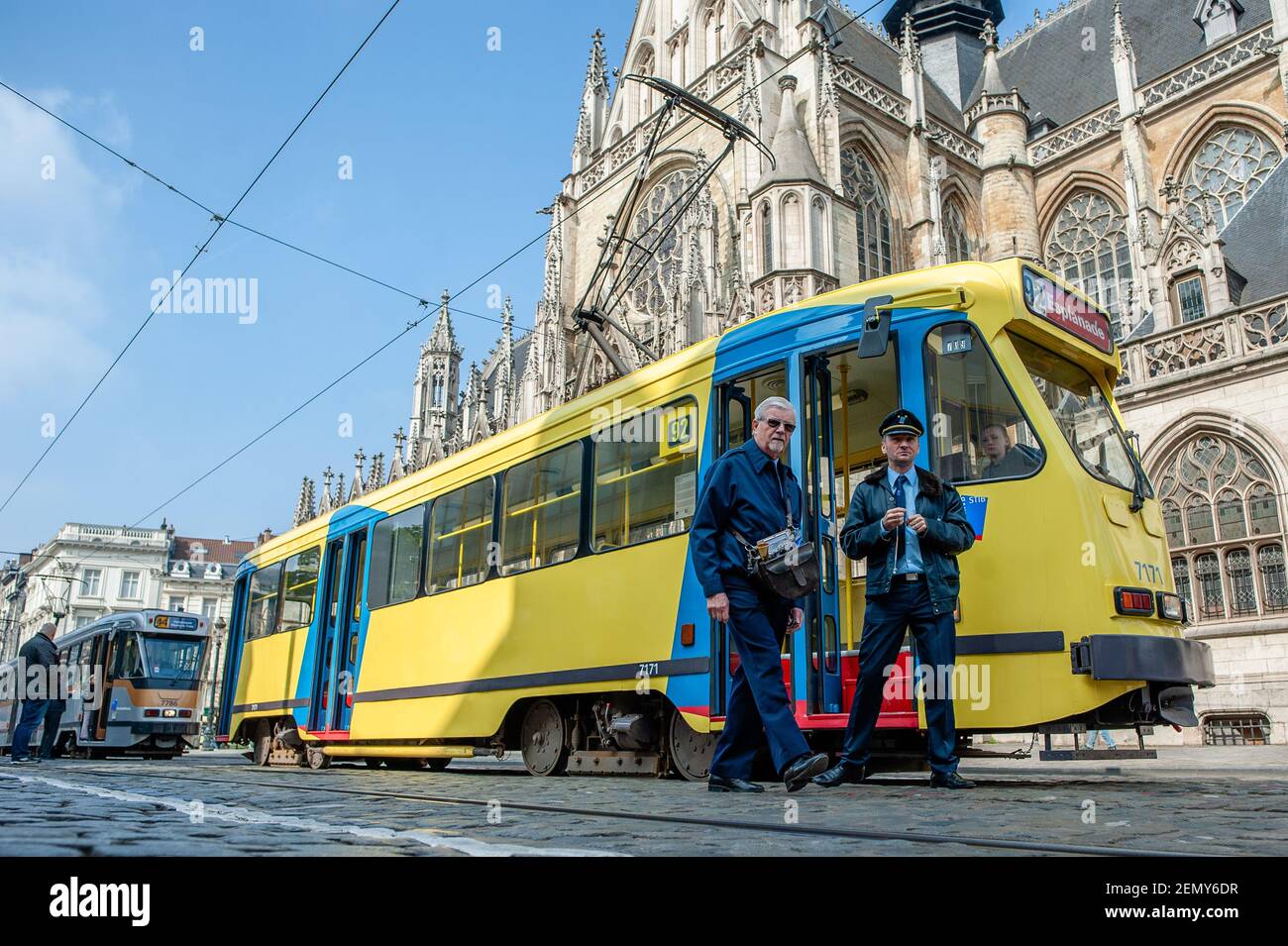 Two tram drivers are seen talking out of an old tram during the ...