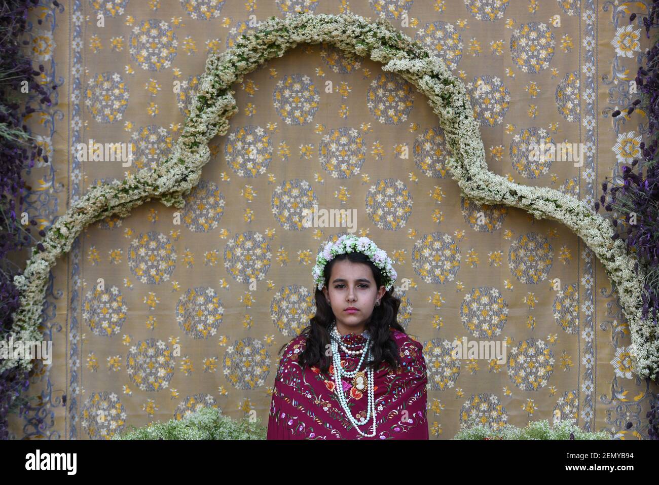 A Maya girl is seen seated in an altar during the traditional ...