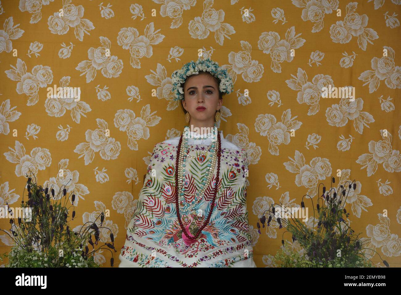 A Maya girl is seen seated in an altar during the traditional ...