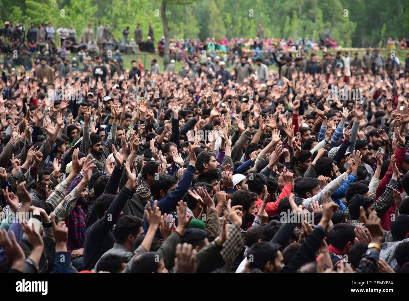 Kashmiri villagers are seen shouting pro-freedom slogans during the ...