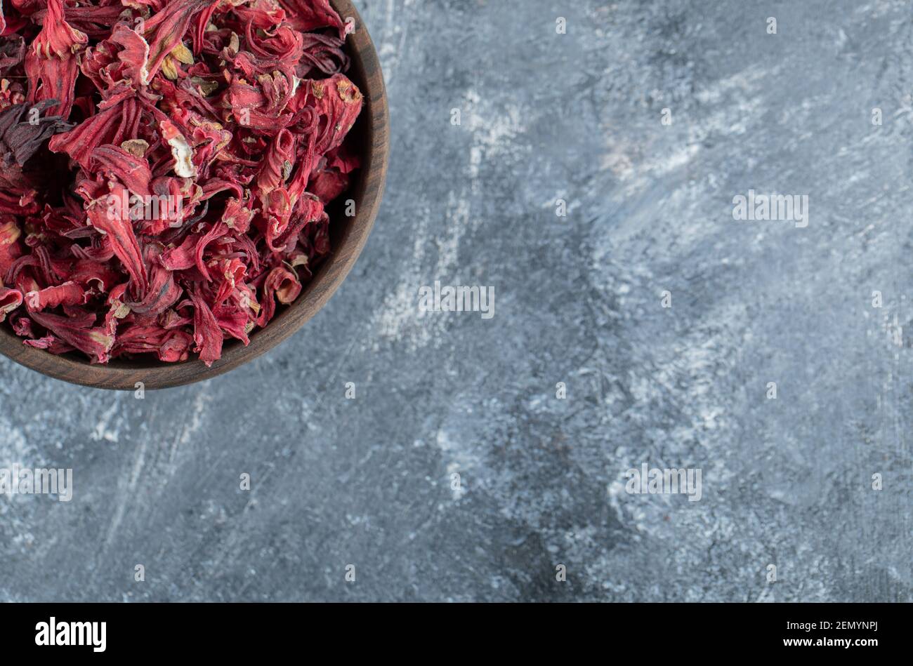 Dry hibiscus petals in wooden bowl Stock Photo - Alamy
