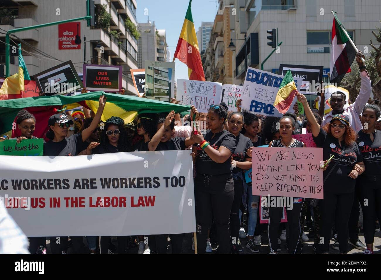 Protesters Are Seen Holding A Banner Flags And Placards During The
