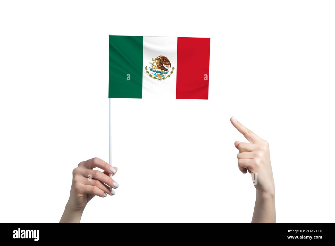 A beautiful female hand holds a Mexico flag to which she shows the ...