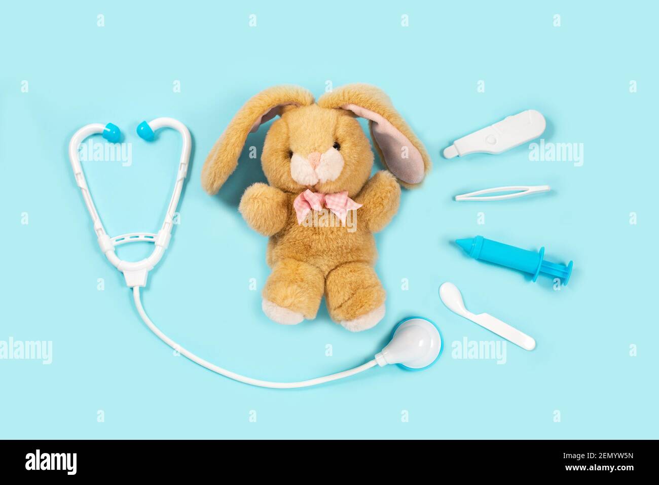 Curing a rabbit. Toy medical devices on a blue background. Kids medical ...