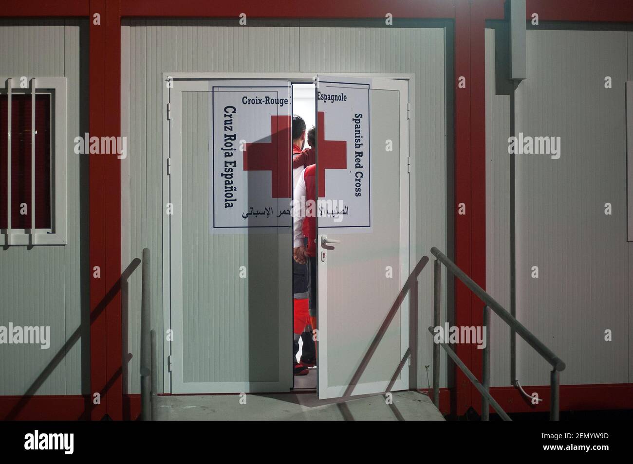 A migrant child is seen carrying by a member of Spanish Red Cross ...