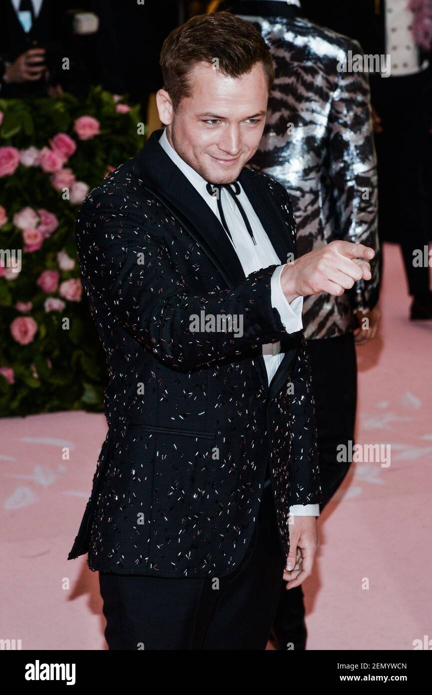 Taron Egerton walking on the red carpet at The Metropolitan Museum of ...
