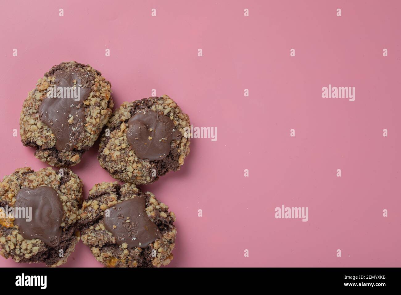 Chocolate crocante cookies with cinnamon flavour on a pink background ...