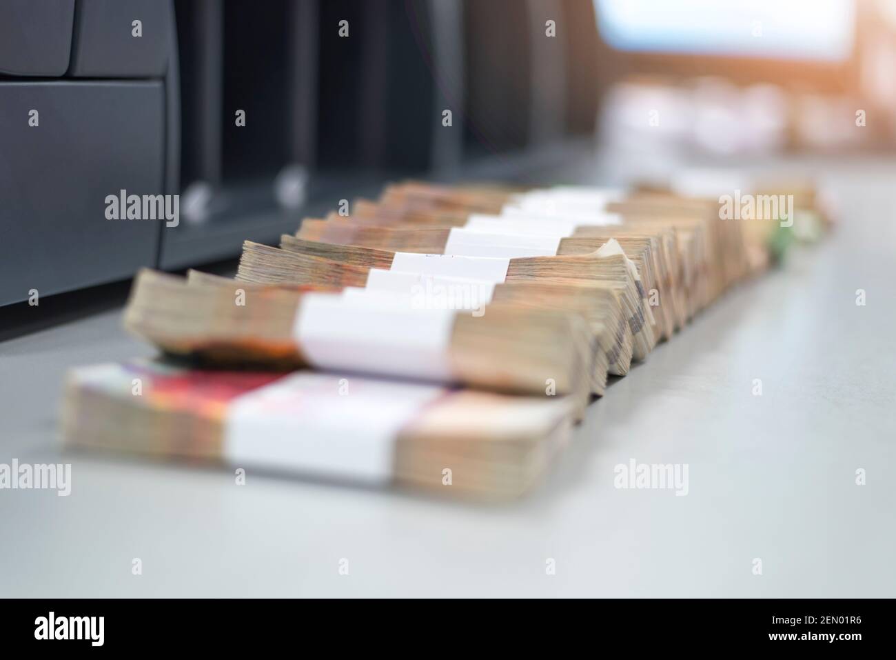 Bundles of banknotes divided into groups with currency straps placed on ...