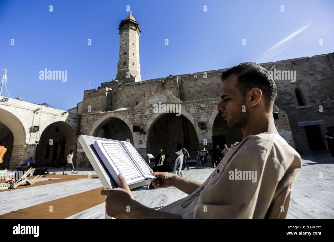 Palestinian man seen reading the Koran at al-Omari mosque during ...