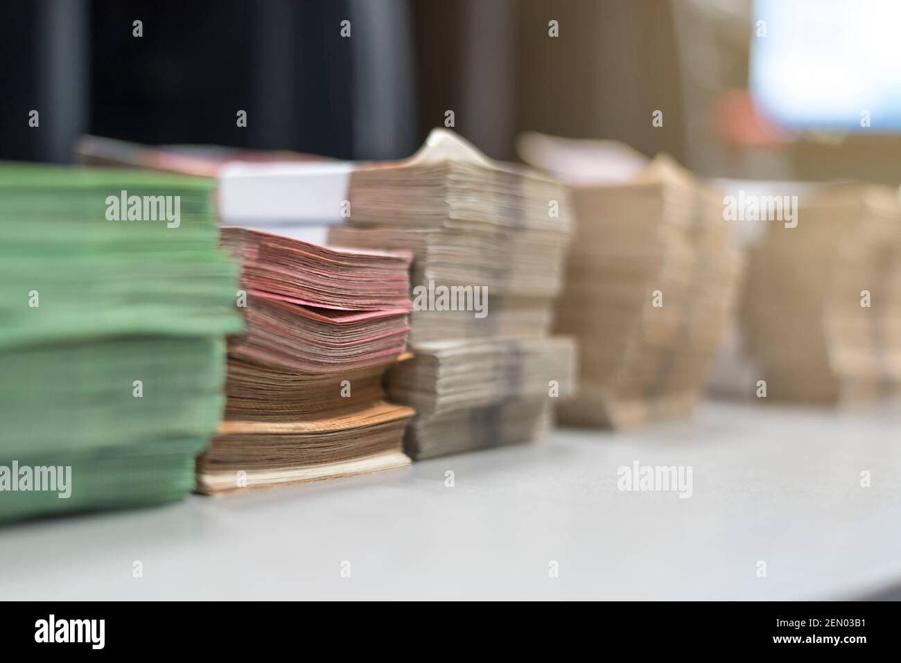 Bundles of banknotes divided into groups with currency straps placed on ...