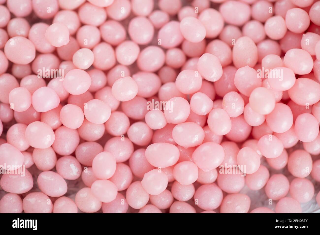 Bunch of sweet pink candies background Stock Photo - Alamy