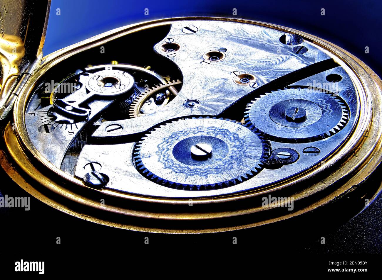 Gold pocket watch clockwork workings open case Stock Photo - Alamy