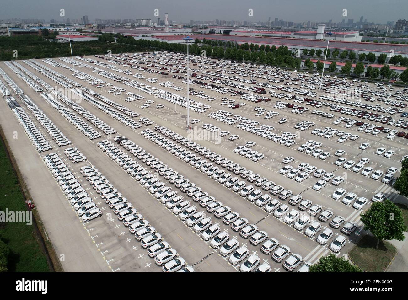 Vehicles are lined up at the auto plant of JAC Motors (Anhui Jianghuai ...