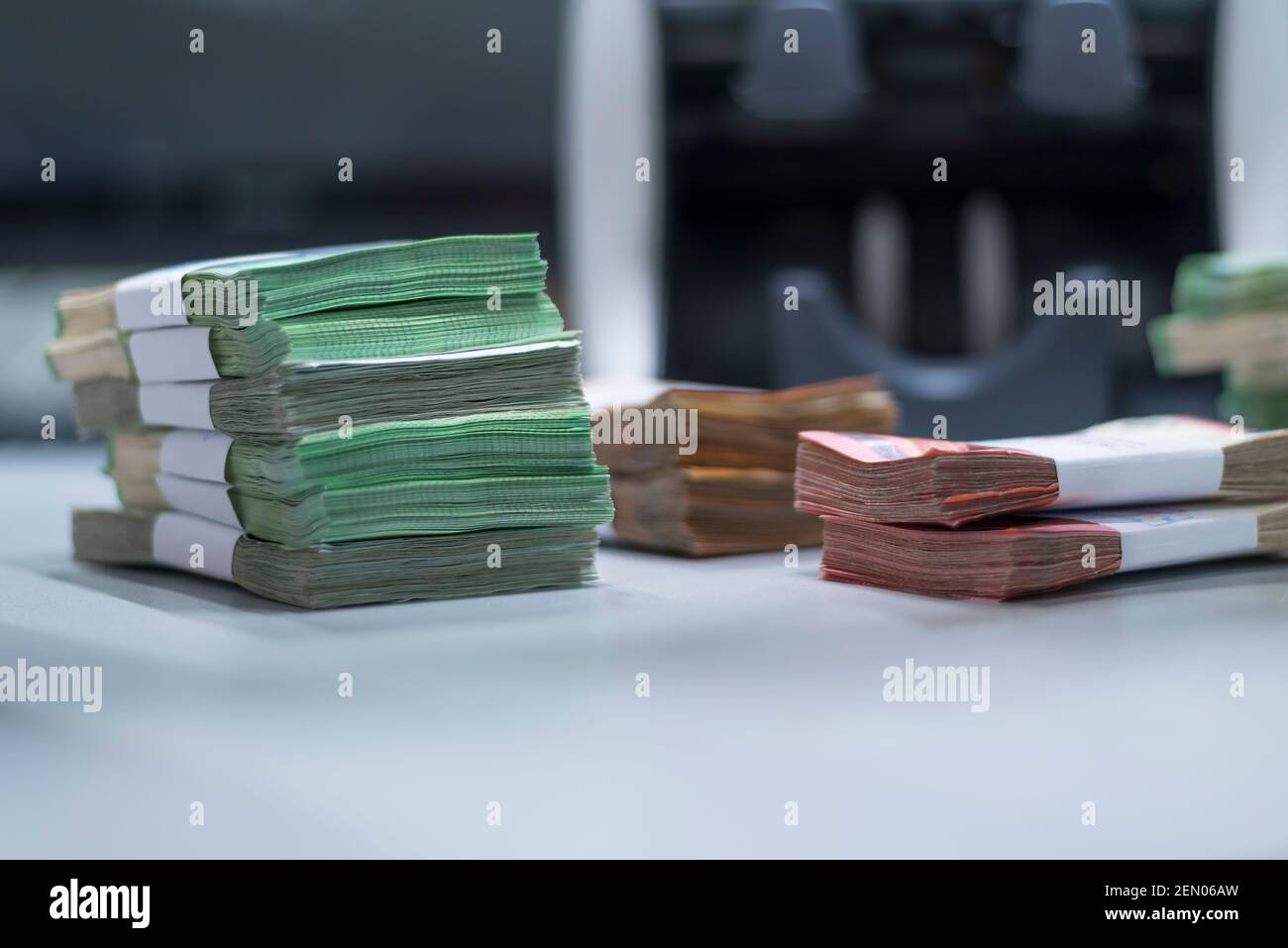 Bank employees sorting and counting money inside bank vault. Large ...