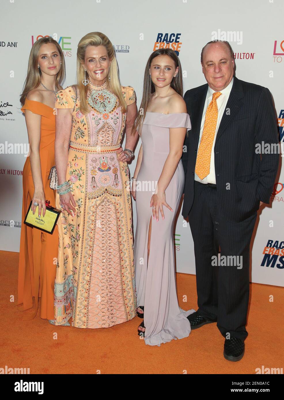 Nancy Davis, her husband Ken Rickel and their daughters Isabella and ...