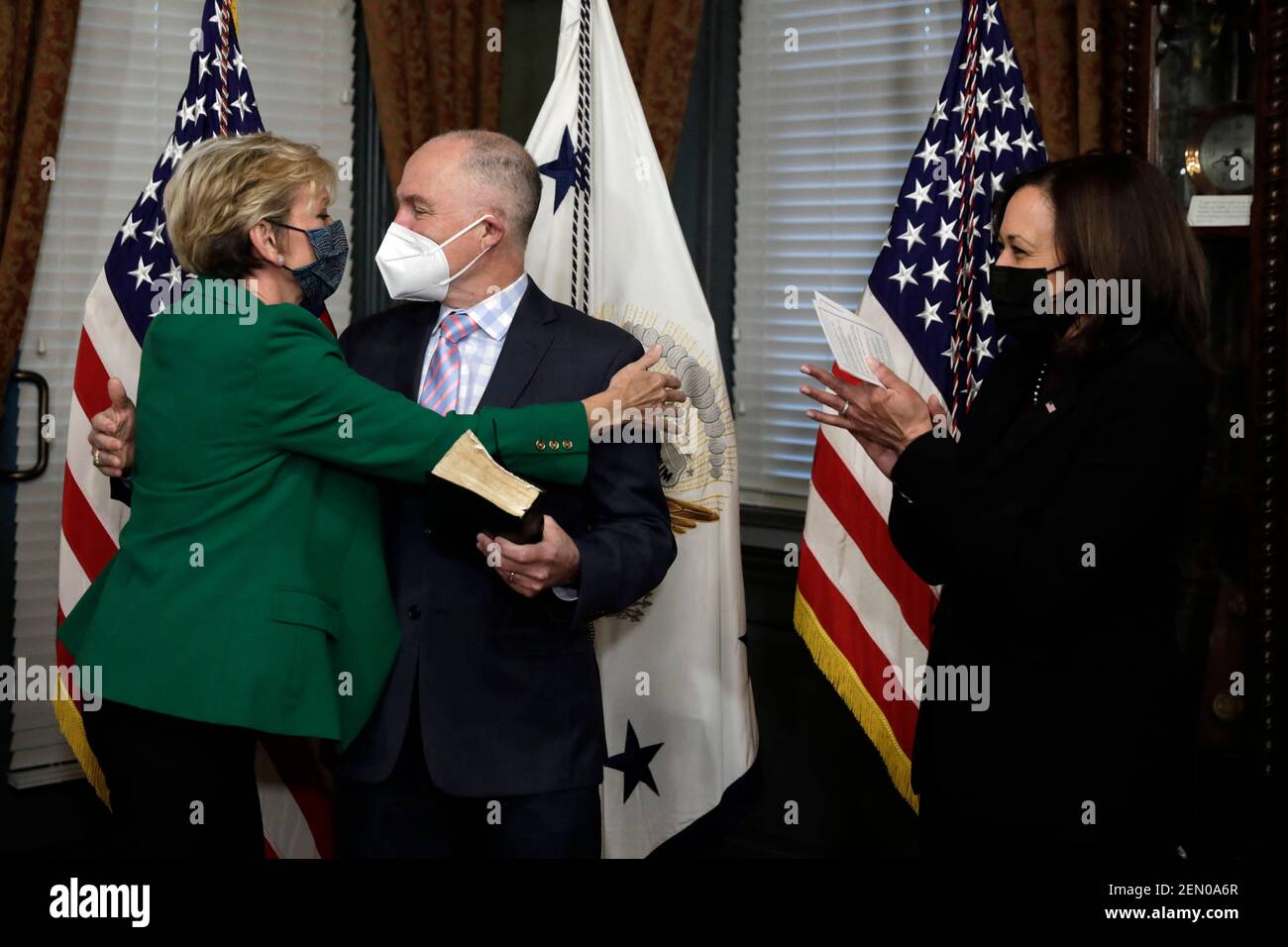 Former Michigan Governor Jennifer Granholm hugs her husband Dan Mulhern ...