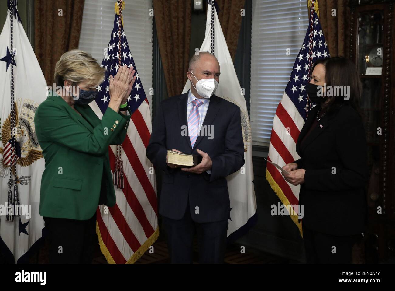 Former Michigan Governor Jennifer Granholm reacts next to her husband ...