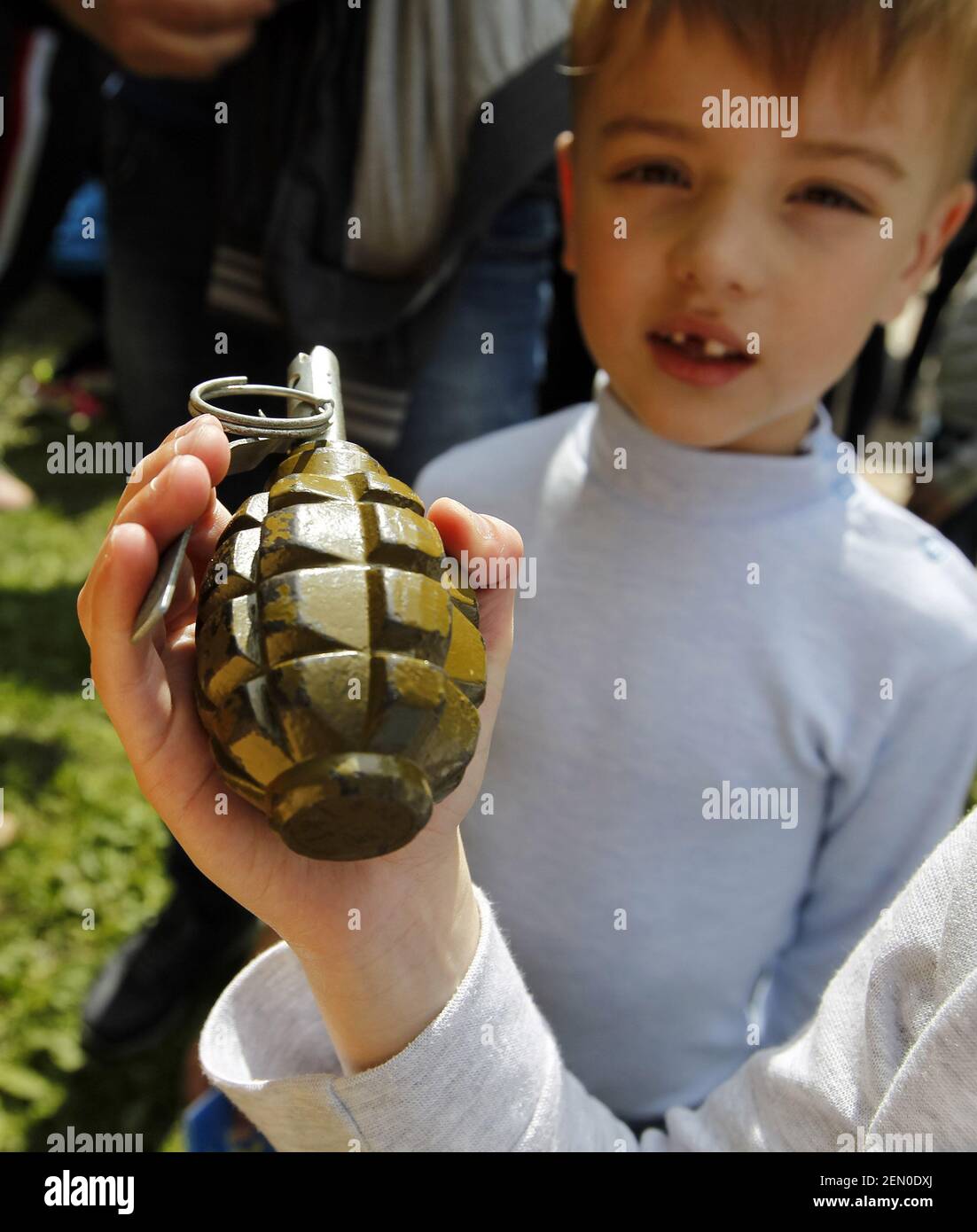 Ukrainian child seen holding a grenade in his hand during the festival ...